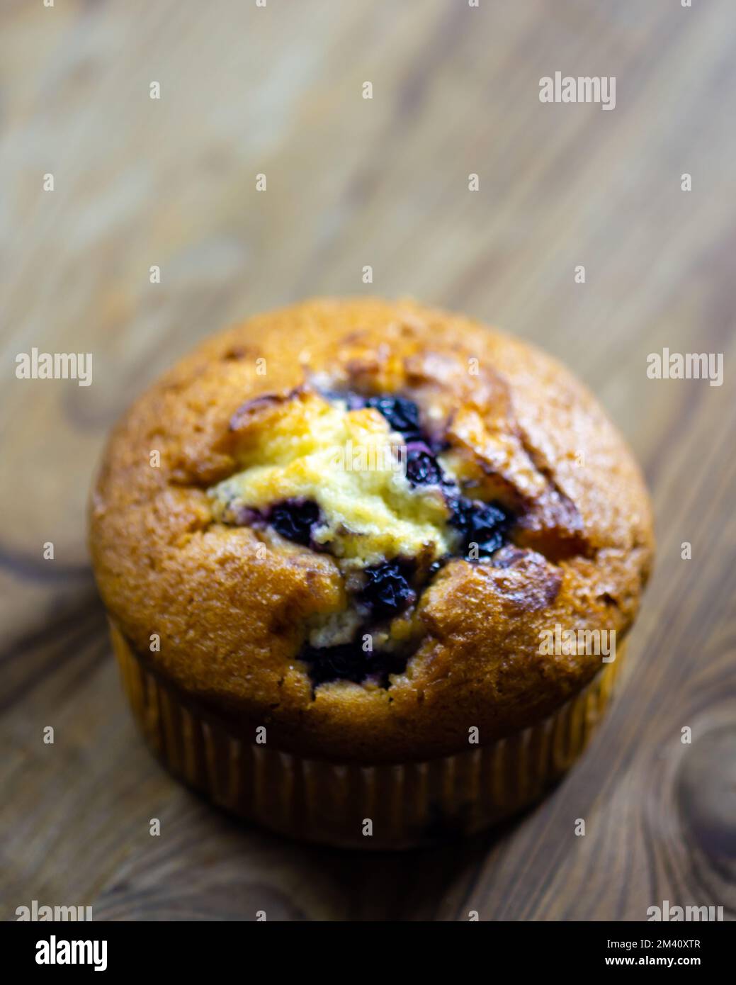 Blueberry muffin on rustic wooden background, closeup Stock Photo - Alamy
