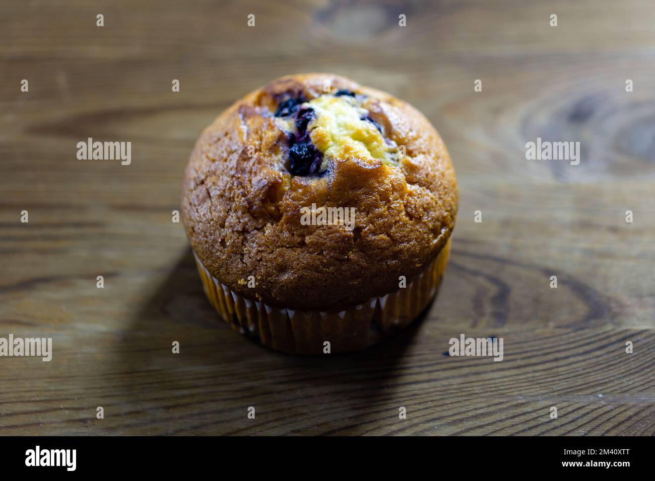 Blueberry muffin on rustic wooden background, closeup Stock Photo - Alamy
