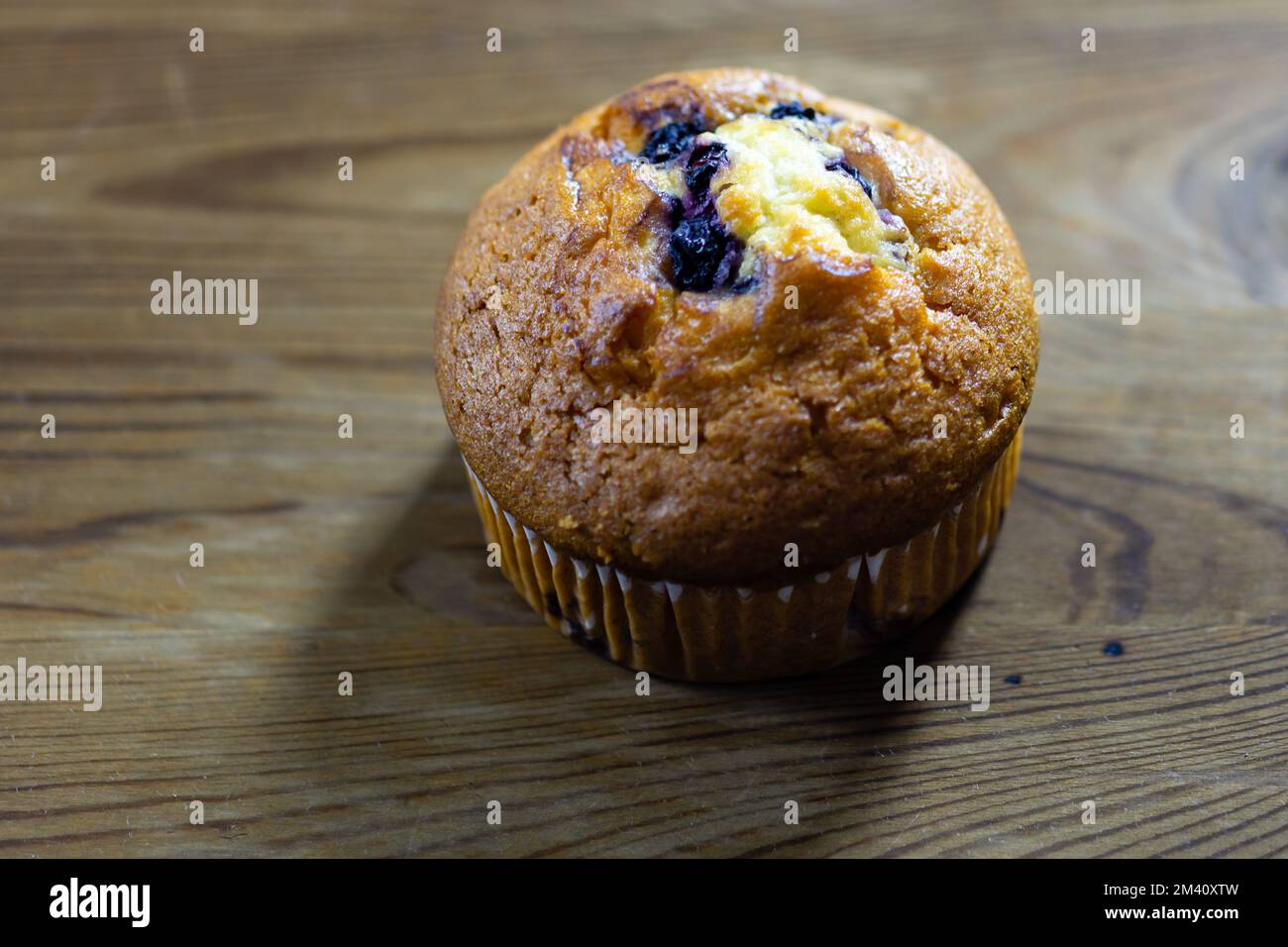 Blueberry muffin on rustic wooden background, closeup Stock Photo - Alamy