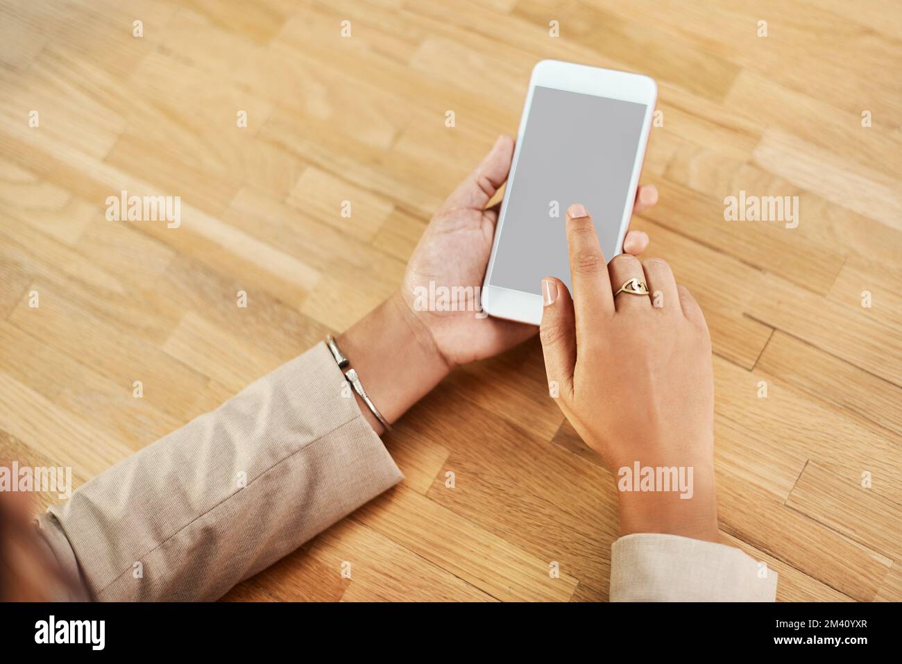 Messaging a few close contacts. an unrecognizable businesswoman using a ...