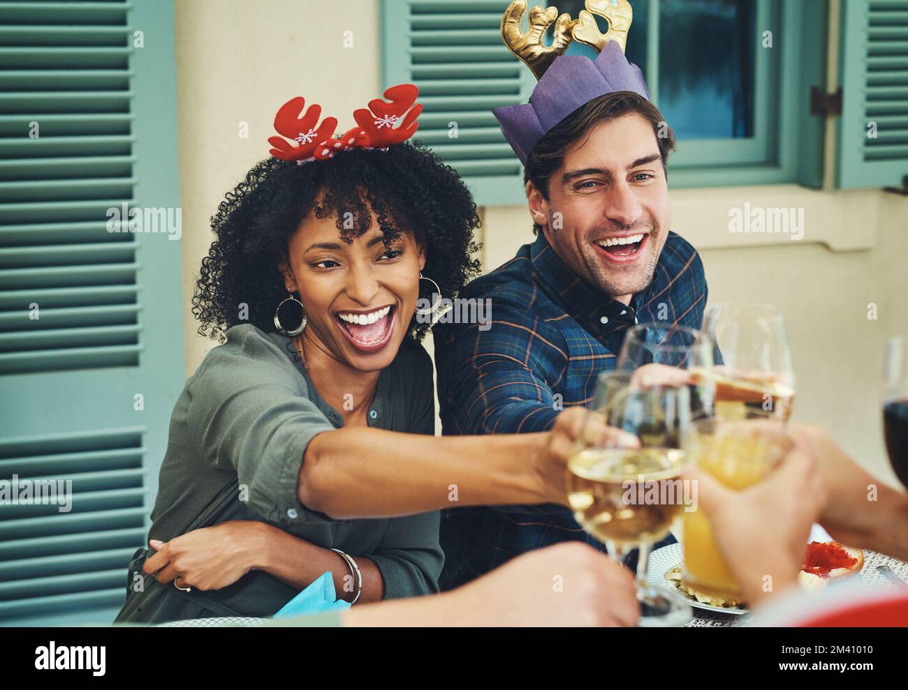 Let the good times roll. a beautiful young couple joining their glasses ...