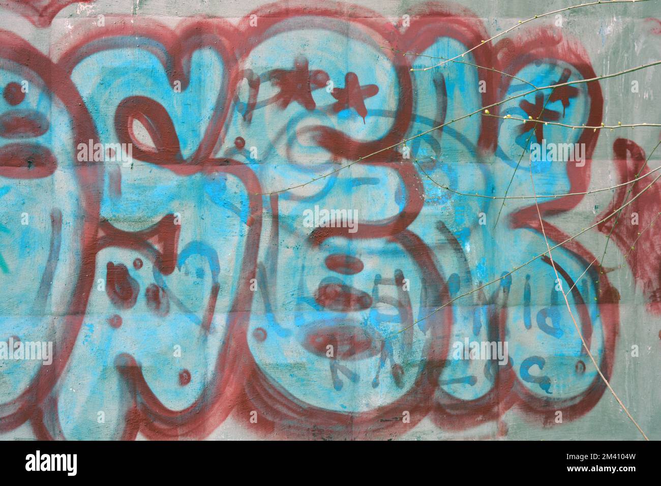 White, blue letters with red dashes, dots, circles, and lines with ...