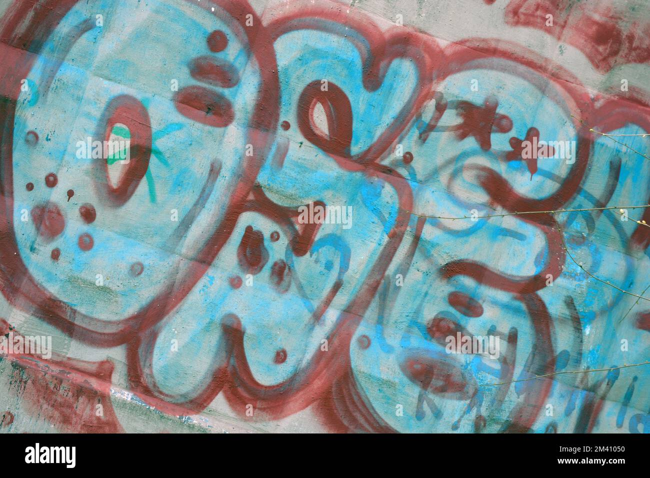 White, blue letters with red dashes, dots, circles, and lines with ...