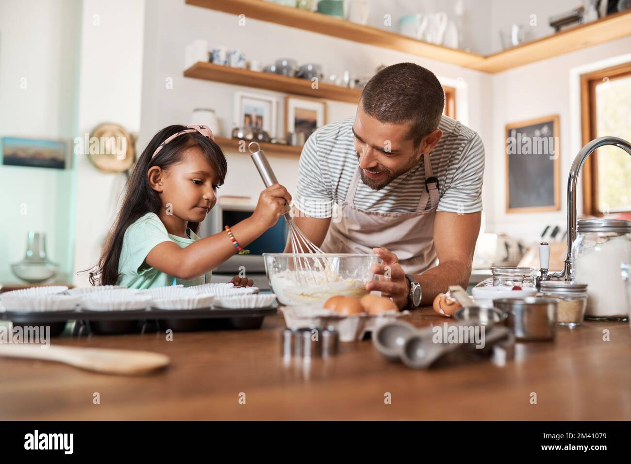 Are you sure you never baked before. a young man baking at home with ...