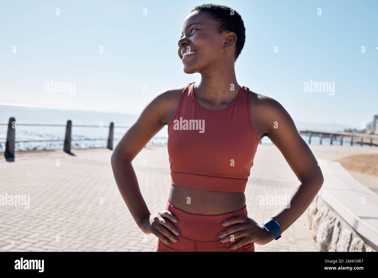 Happy, fitness and black woman on the promenade for running, cardio ...