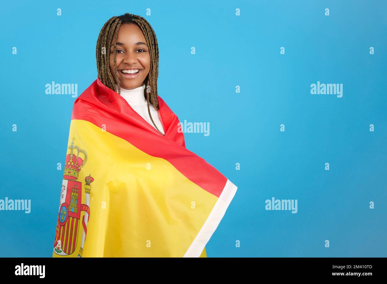 African woman wrapped in a spanish national flag Stock Photo - Alamy