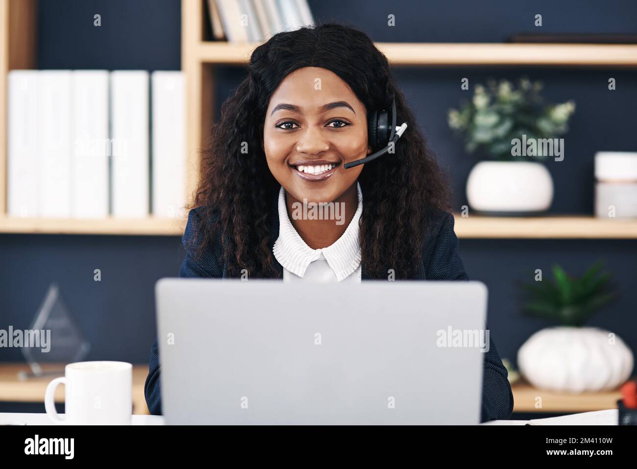 Available for any query you may have. a young woman using a laptop and ...