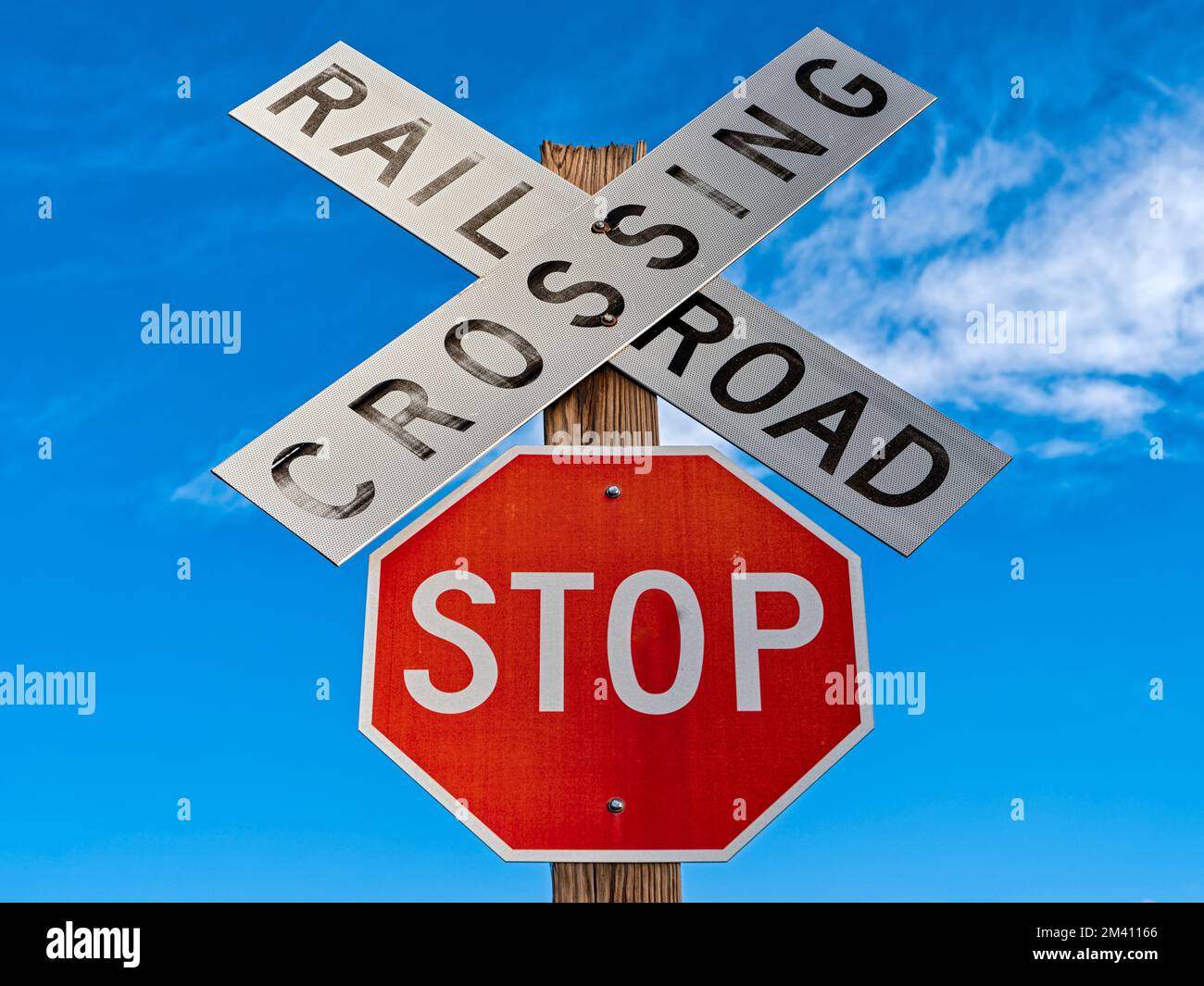 A stop sign and railroad crossing signs Stock Photo - Alamy