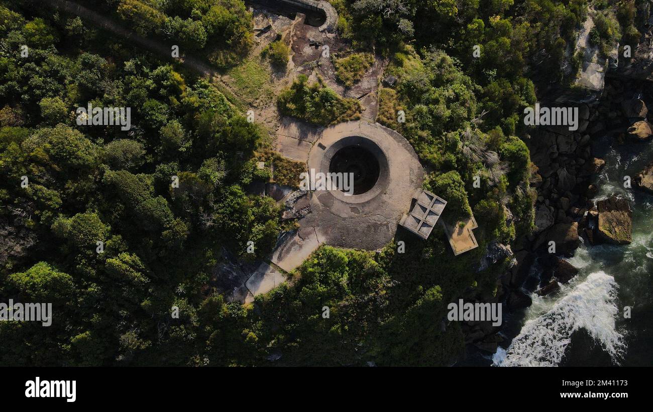 A drone shot over an old base camp from World War 2 surrounded by ...