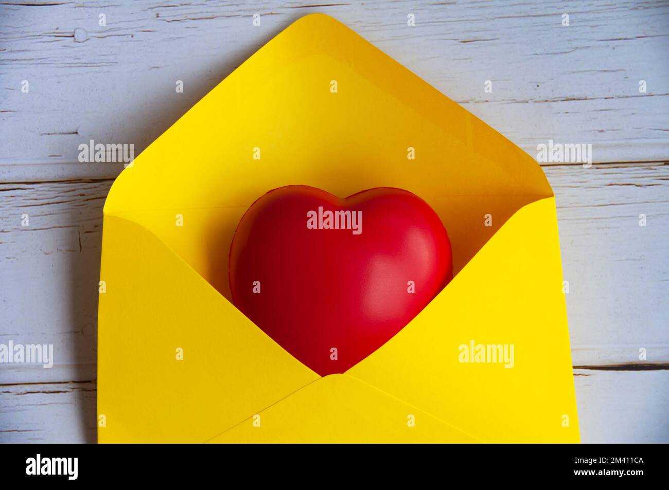 Love letter with heart shape sheet in yellow paper envelope. Love ...