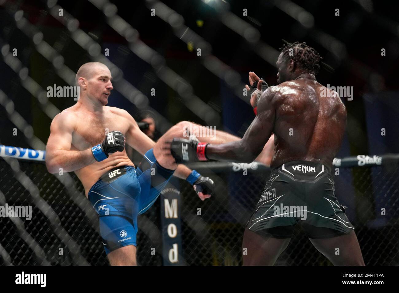 LAS VEGAS, NV - DECEMBER 17: (L-R) Sean Strickland kicks Jared ...