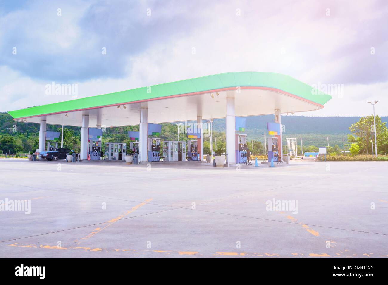 Gas fuel station with clouds in the sky and sun light Stock Photo - Alamy