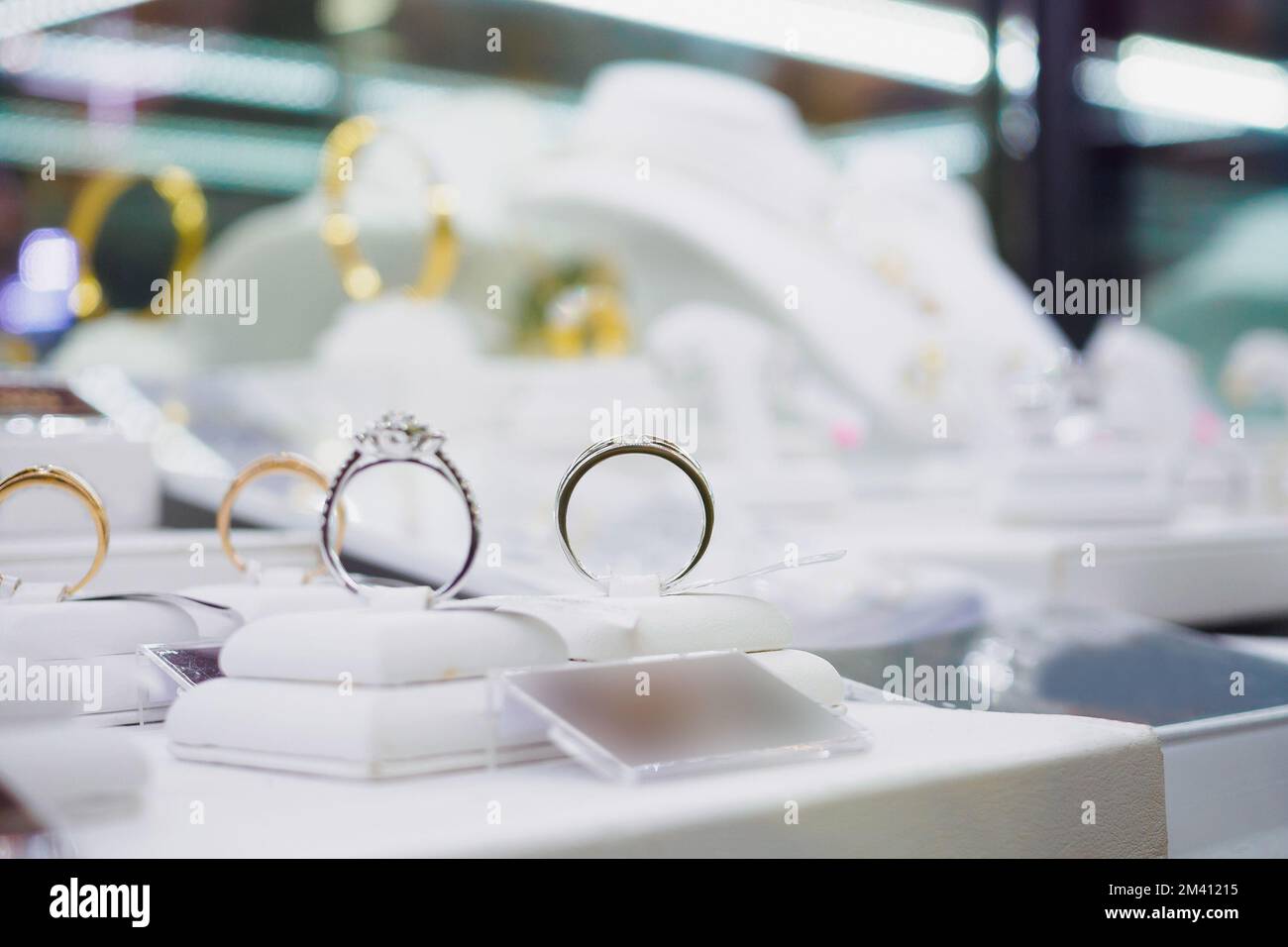 Jewelry diamond rings and necklaces show in luxury retail store window ...
