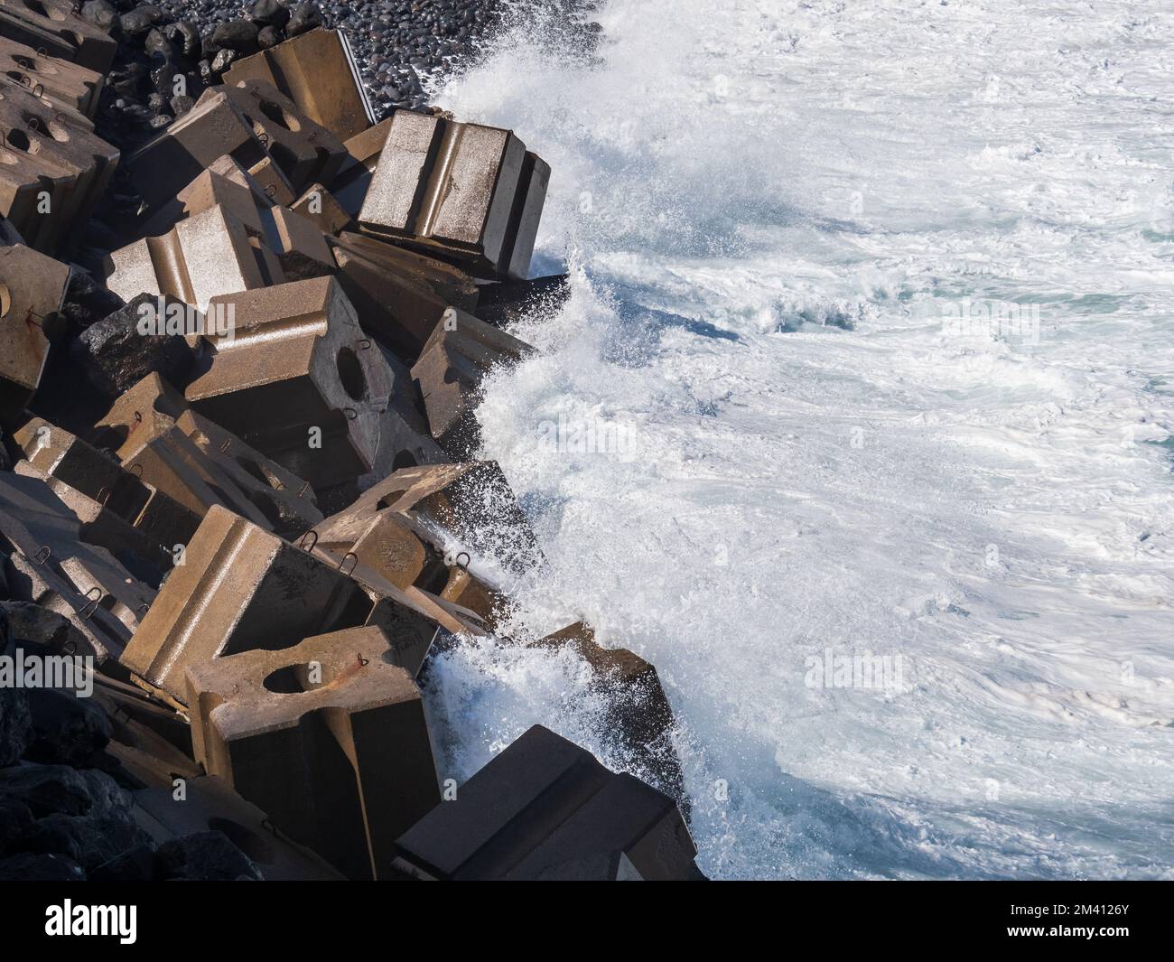 Wave-dissipating concrete blocks to minimize the effects of wave action ...
