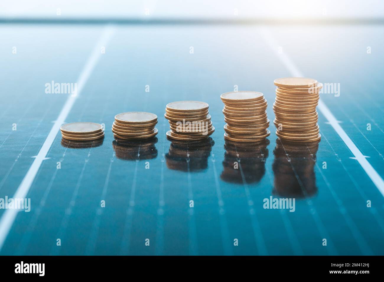 Money saved by using energy with solar panel Stock Photo - Alamy