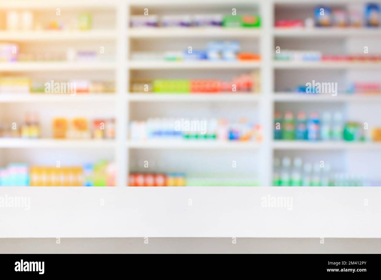 pharmacy counter with blur medicines shelves in the drugstore ...
