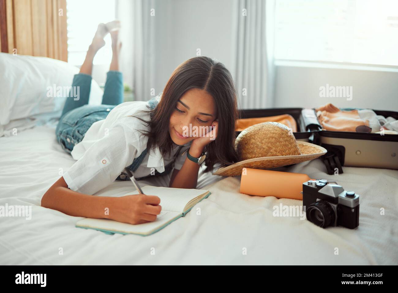 Writing, notebook and travel with woman and suitcase for planning ...