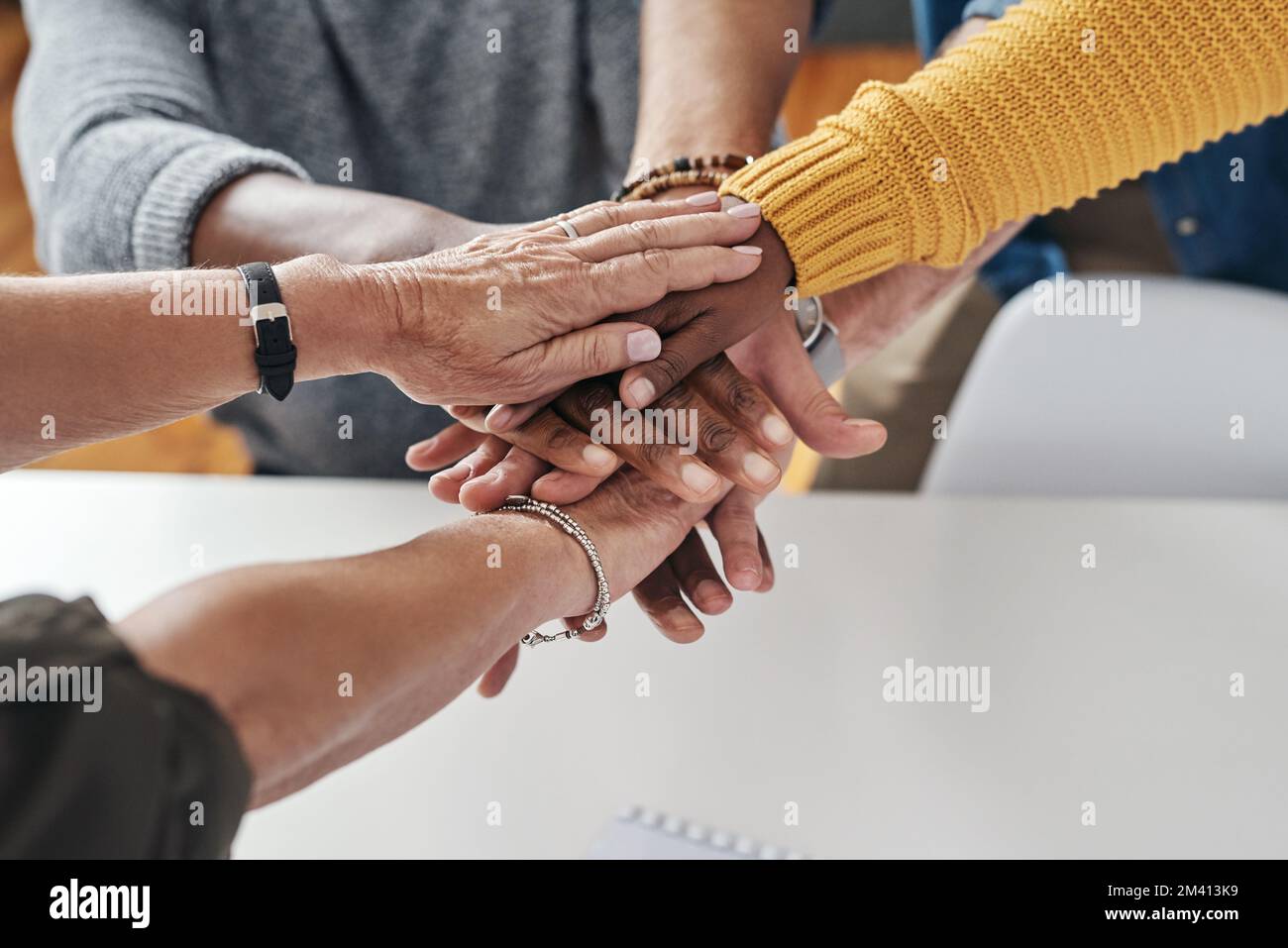 Hand in hand in the journey to success. a group of unrecognizable ...