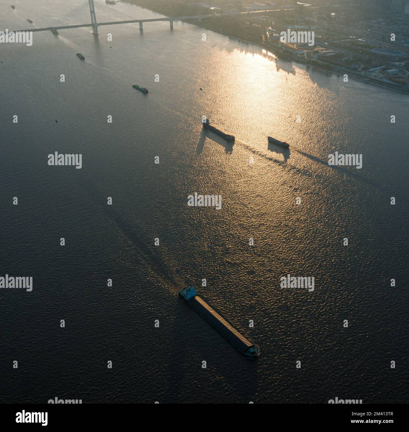 A bird's eye view of ships sailing through a canal at sunset Stock ...
