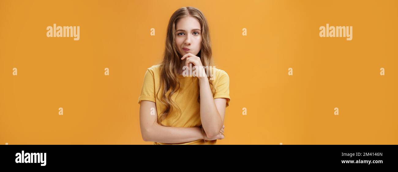 Hmm choices difficult. Portrait of focus serious-looking creative young ...