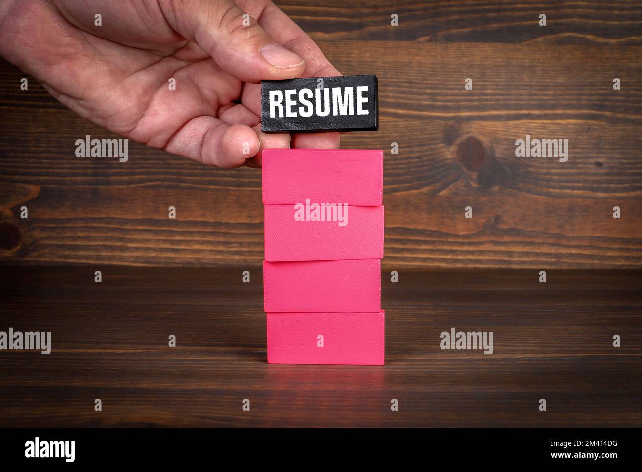 Resume. Red and black block on wooden background Stock Photo - Alamy