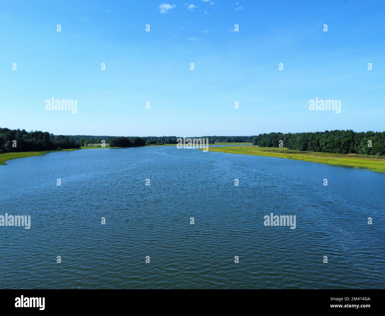 An aerial view of a river in the green field Stock Photo - Alamy