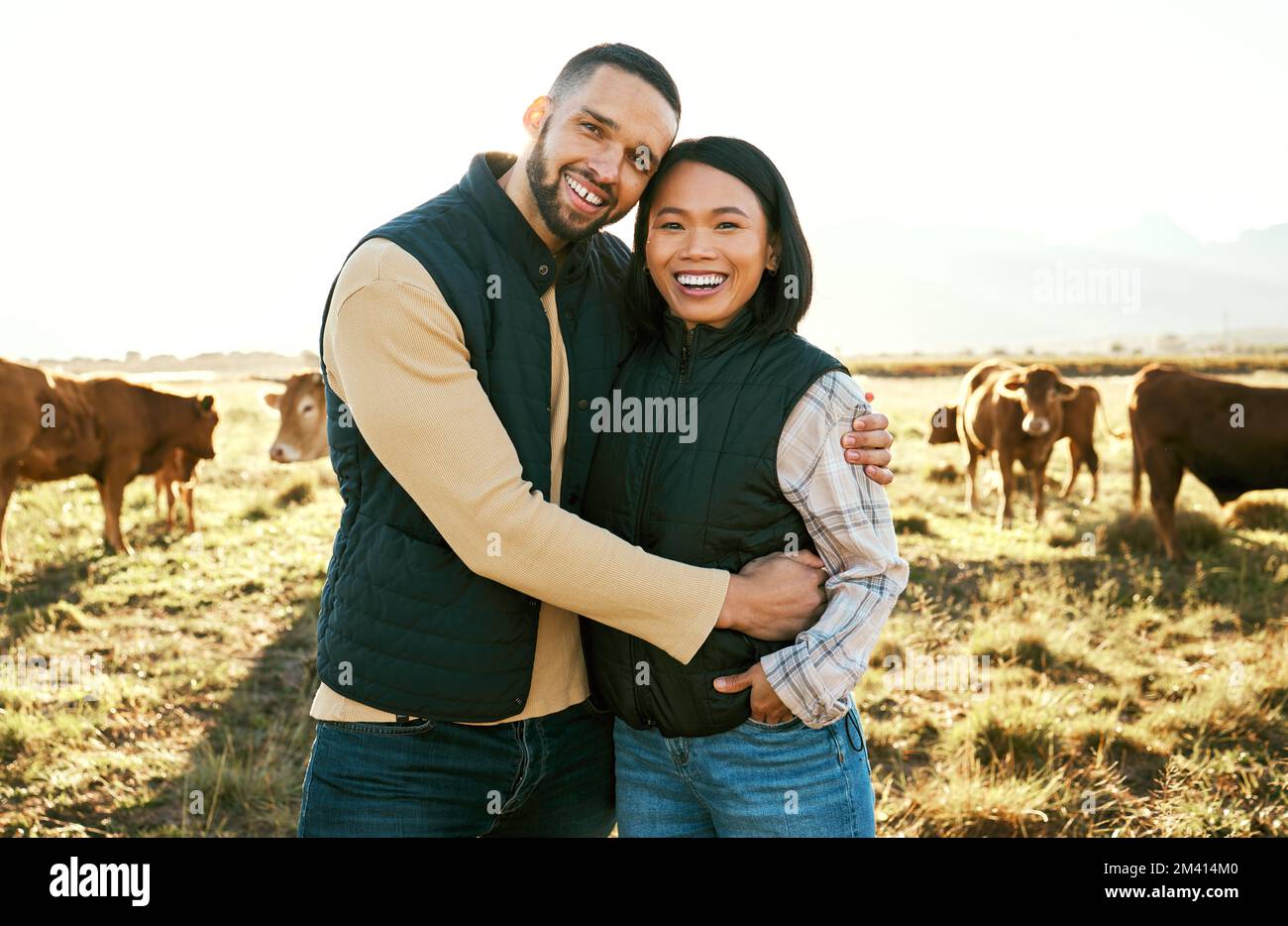 Cow, farm and couple portrait on field in countryside for meat, beef or ...