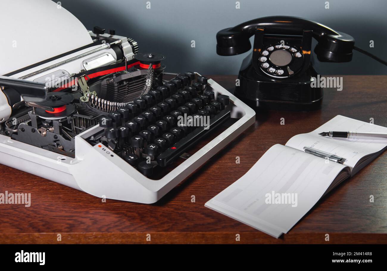 retro typewriter, old telephone, checkbook, ink pen - still life Stock ...