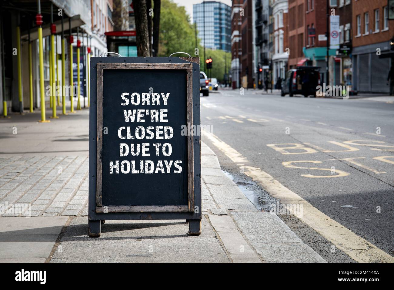 Sorry we're CLOSED due to HOLIDAYS. Foldable advertising poster on the ...
