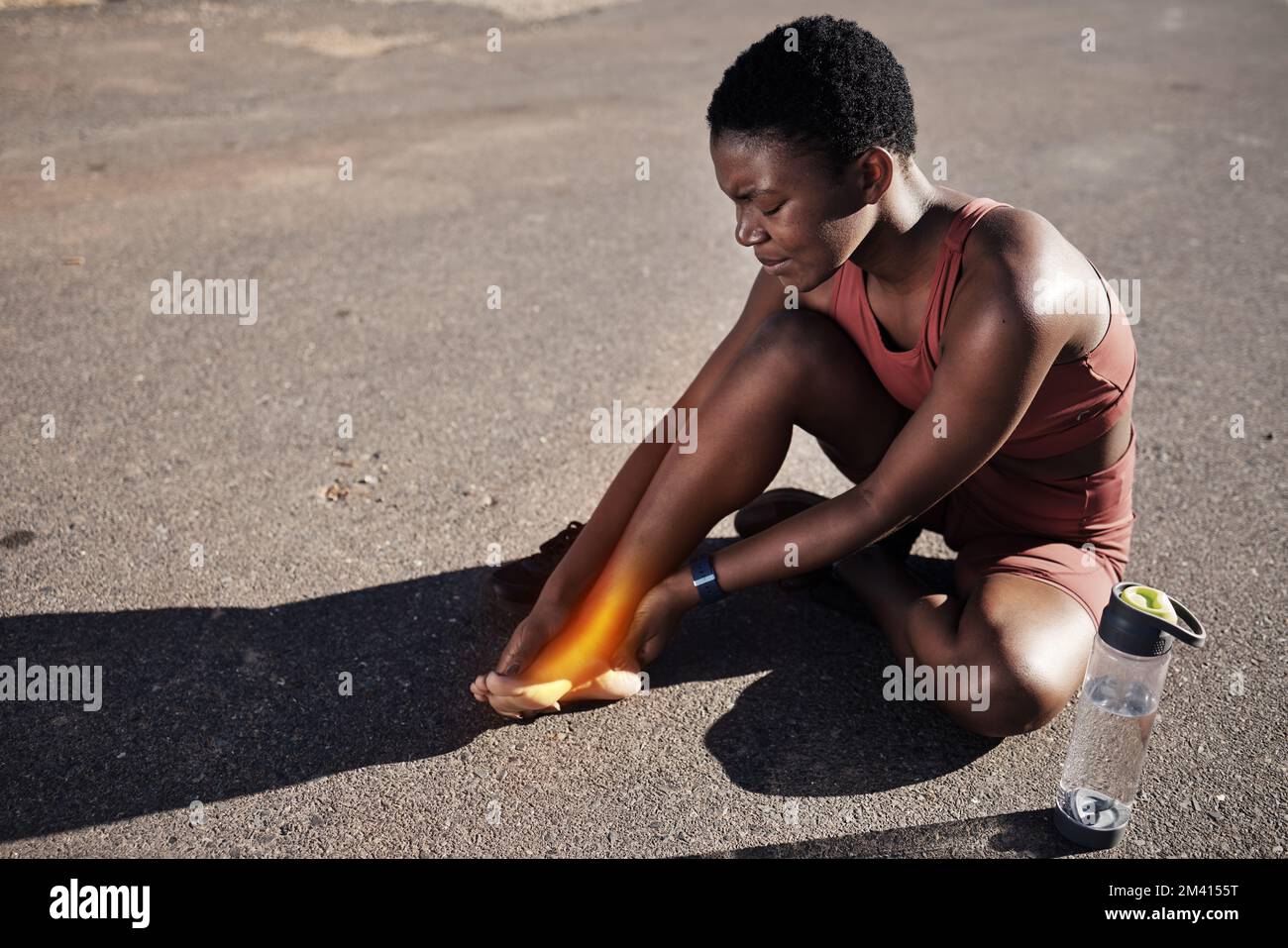 Injury, running and black woman with foot pain, training accident and ...