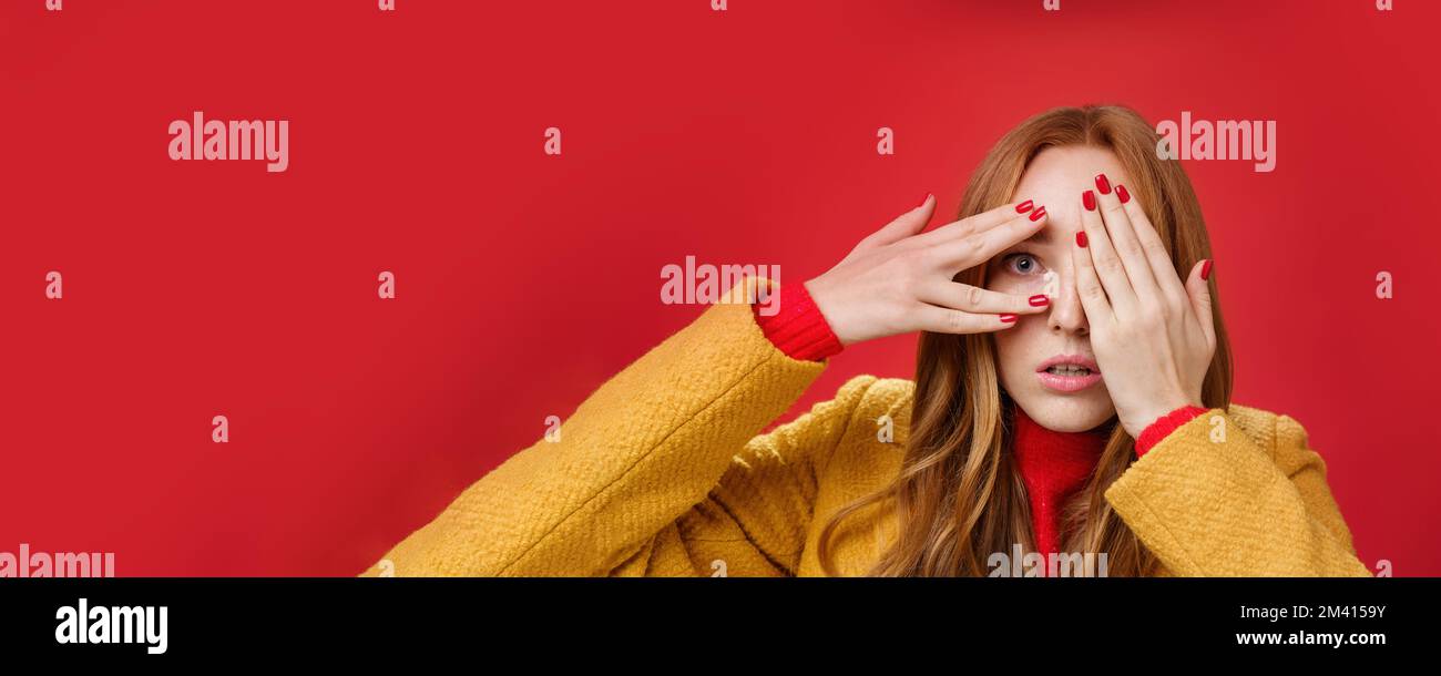 Stunned and shocked redhead woman cannot believe what terrible thing ...