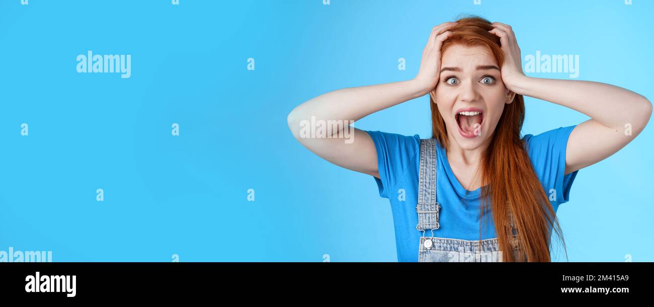 Shocked redhead girl shouting panic, feel pressured deadlines, scared ...