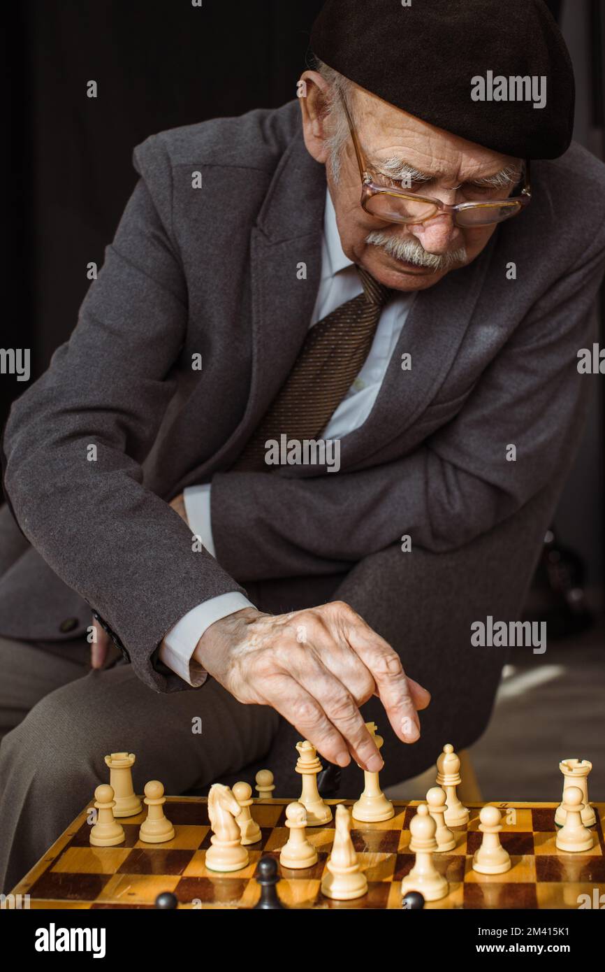 An old man plays chess Stock Photo - Alamy