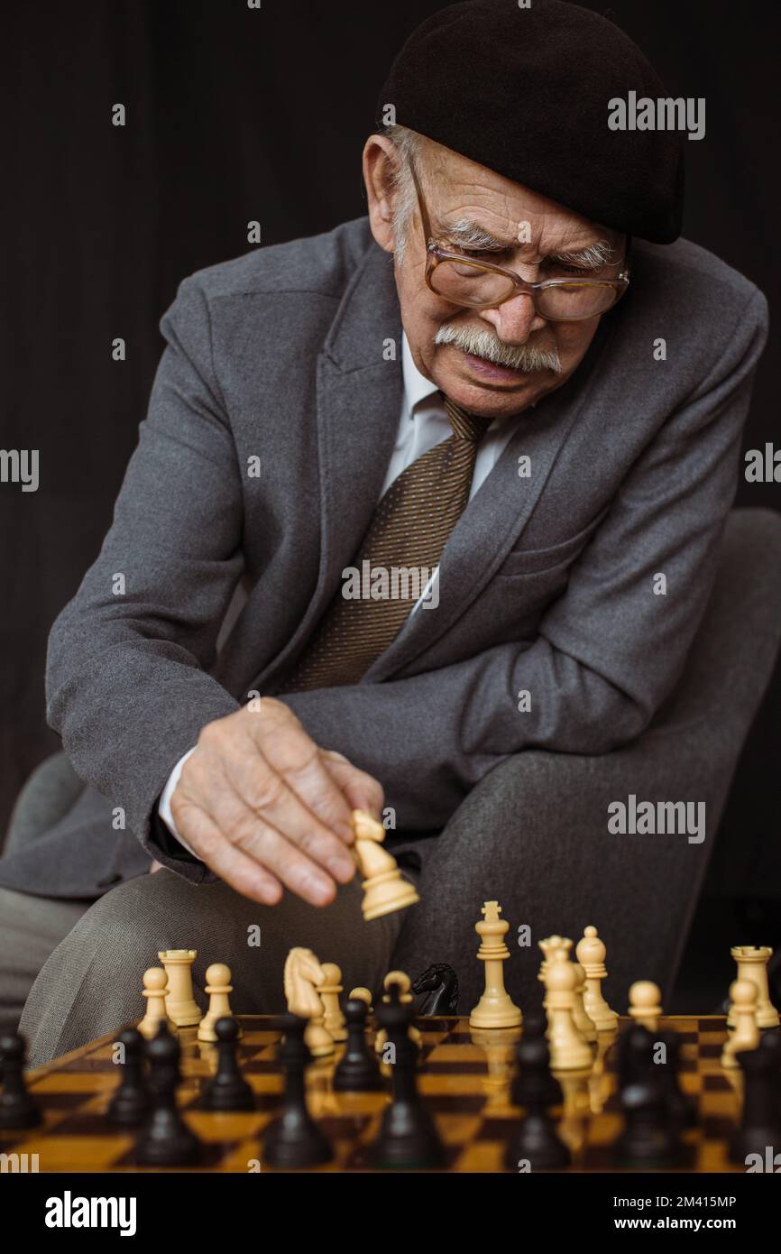 An old man plays chess Stock Photo - Alamy