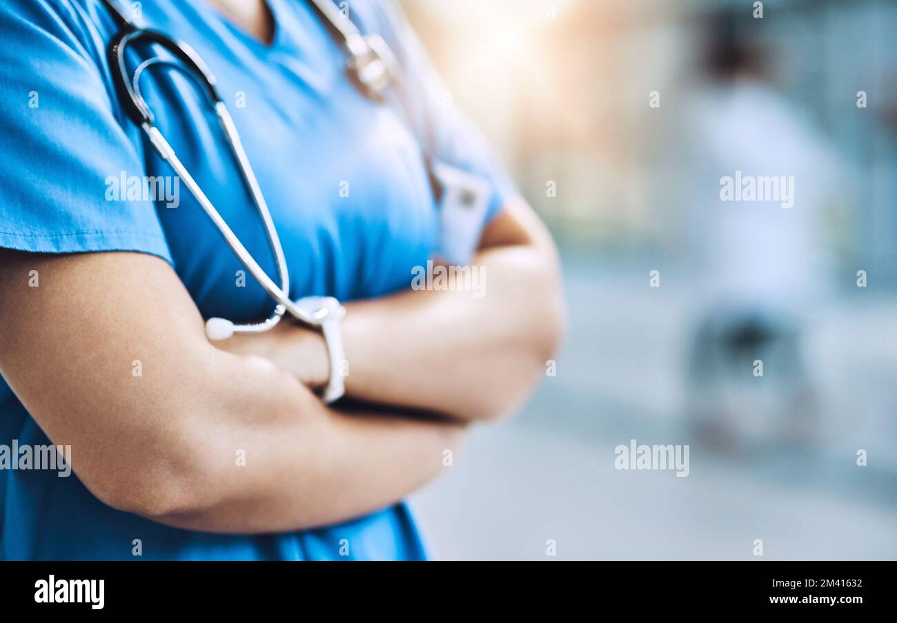 Ready to save lives. a female nurse standing with her arms crossed ...