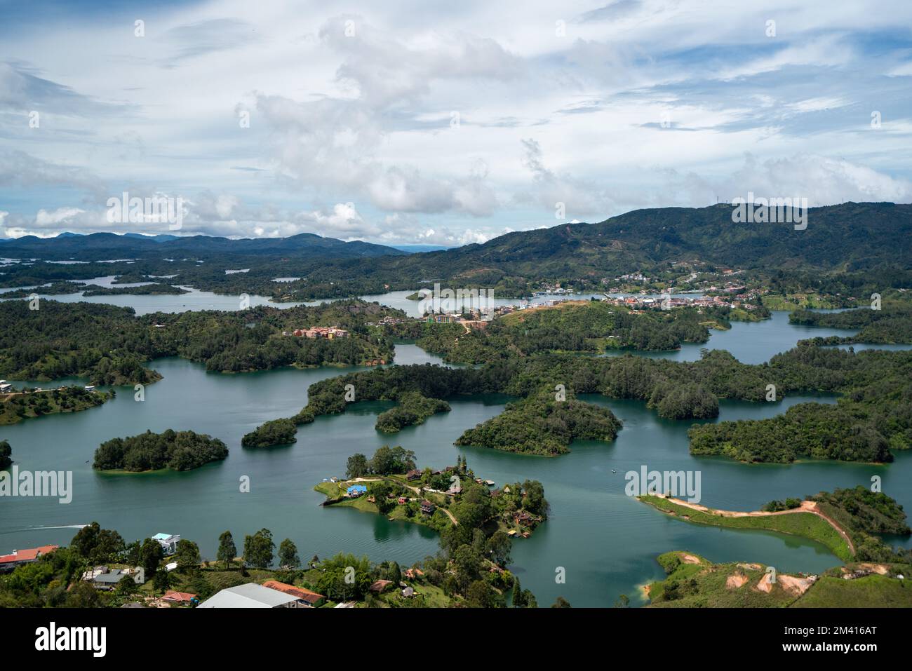 An aerial view of a landscape with lakes and lush vegetation in Guatape ...