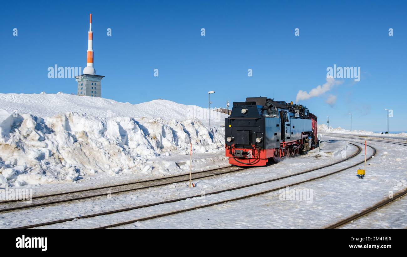 Steam train during winter in the snow in the Harz national park Germany ...