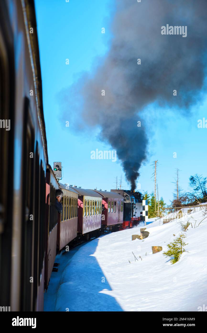 Steam train during winter in the snow in the Harz national park Germany ...