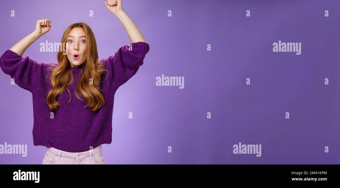 Excited and thrilled woman reacting to unexpected goal raising hands in ...