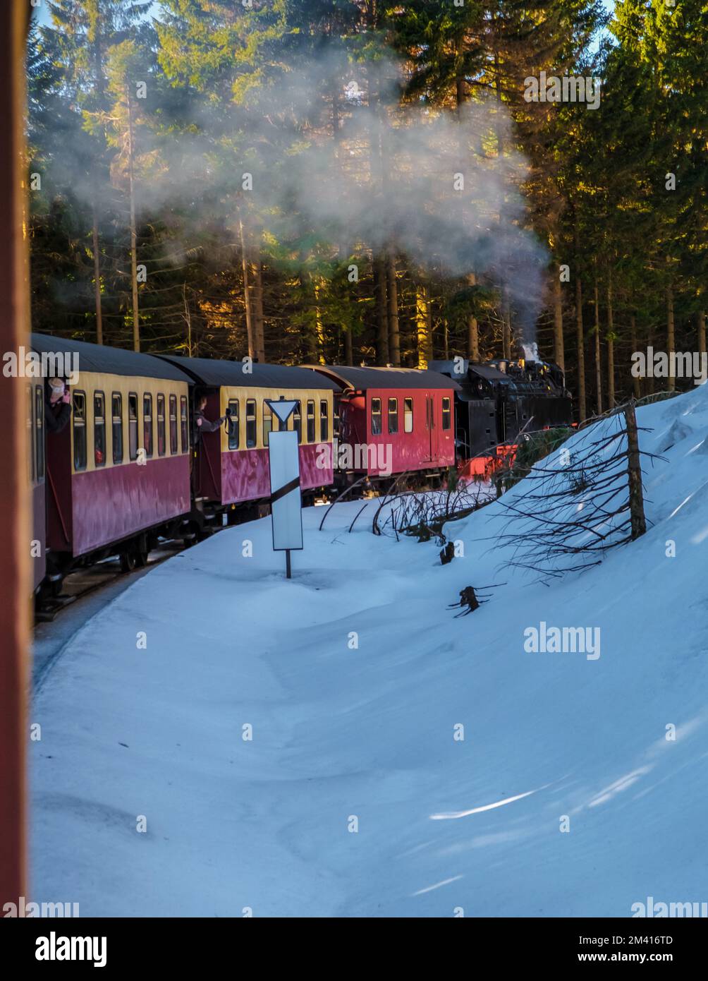 Steam train during winter in the snow froest in the Harz national park ...