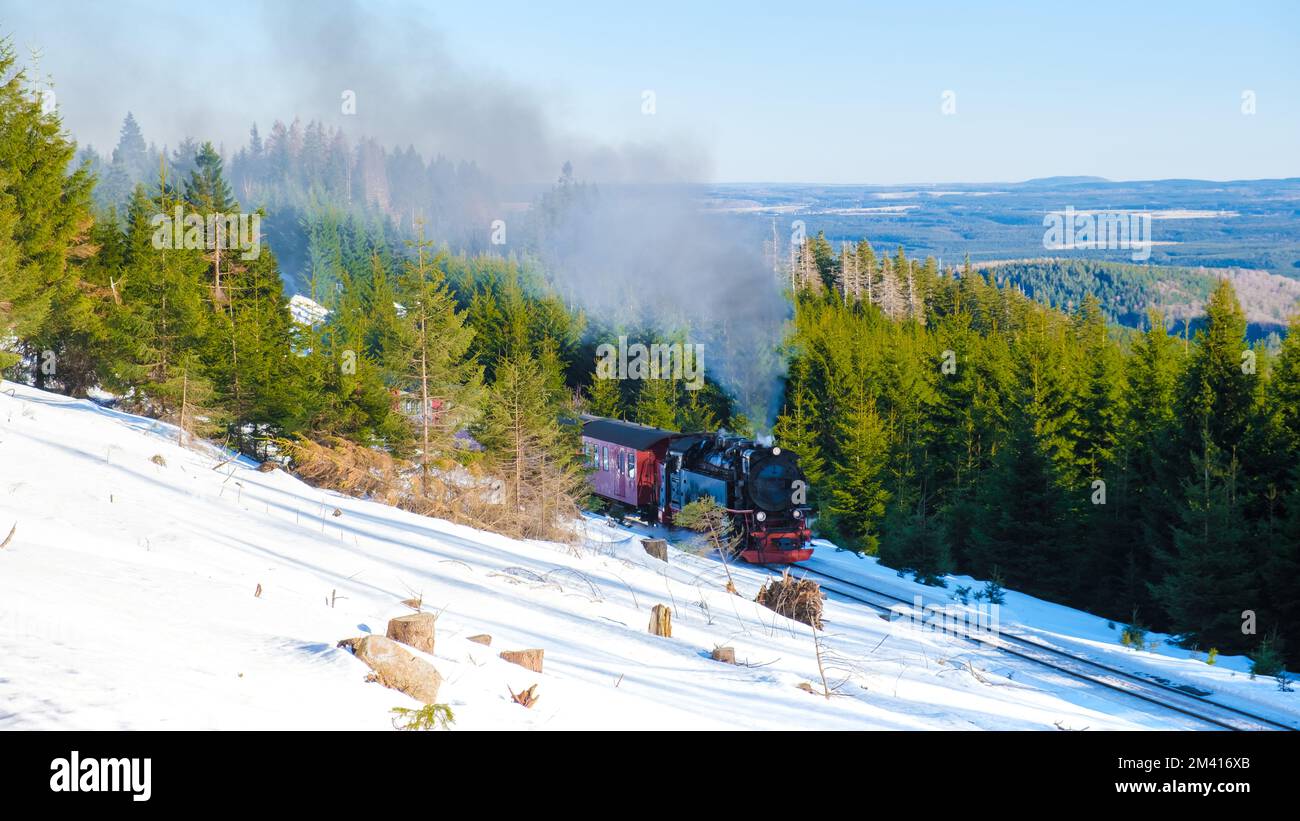 Steam train during winter in the snow in the Harz national park Germany ...