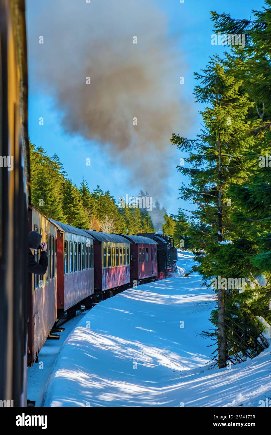 Steam train during winter in the snow in the Harz national park Germany ...
