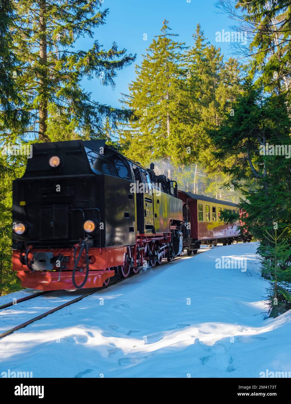 Steam train during winter in the snow in the Harz national park Germany ...