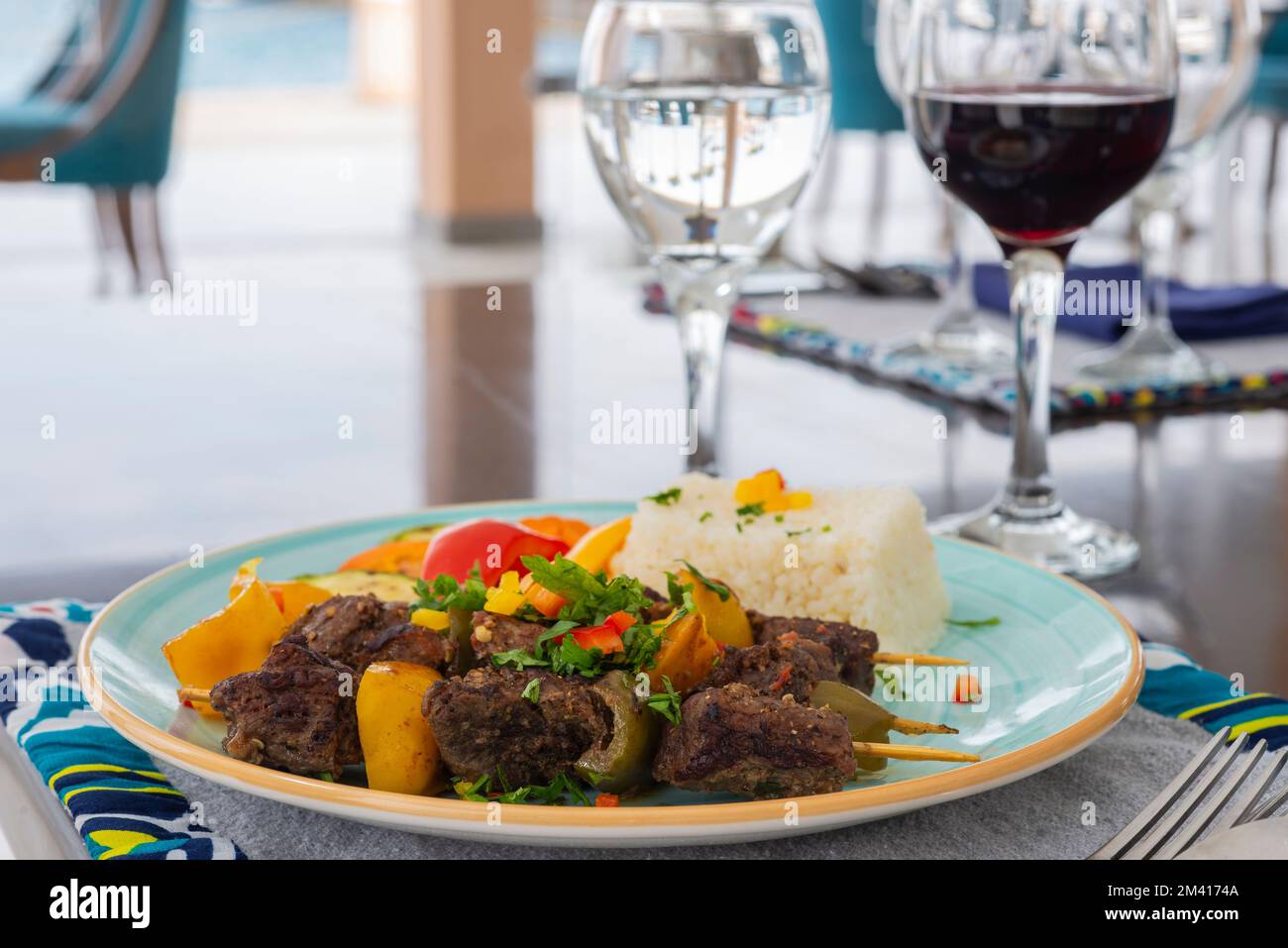 Shish Kebab a la carte meal with vegetables and white rice on a plate ...