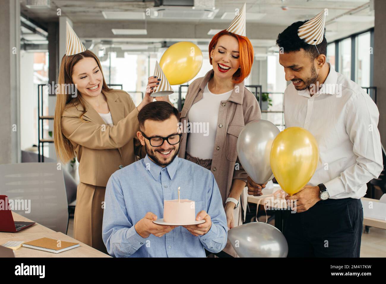 Business team celebrating a birthday of collegue in the modern office ...