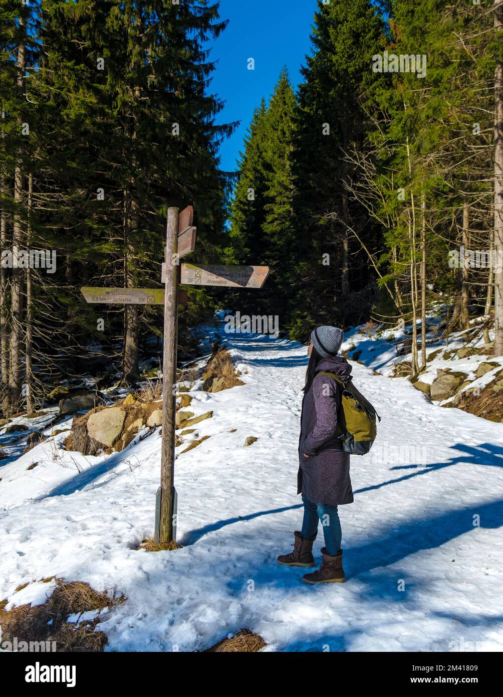 Asian Thai women hiking in the snow at Brocken mountain during winter ...