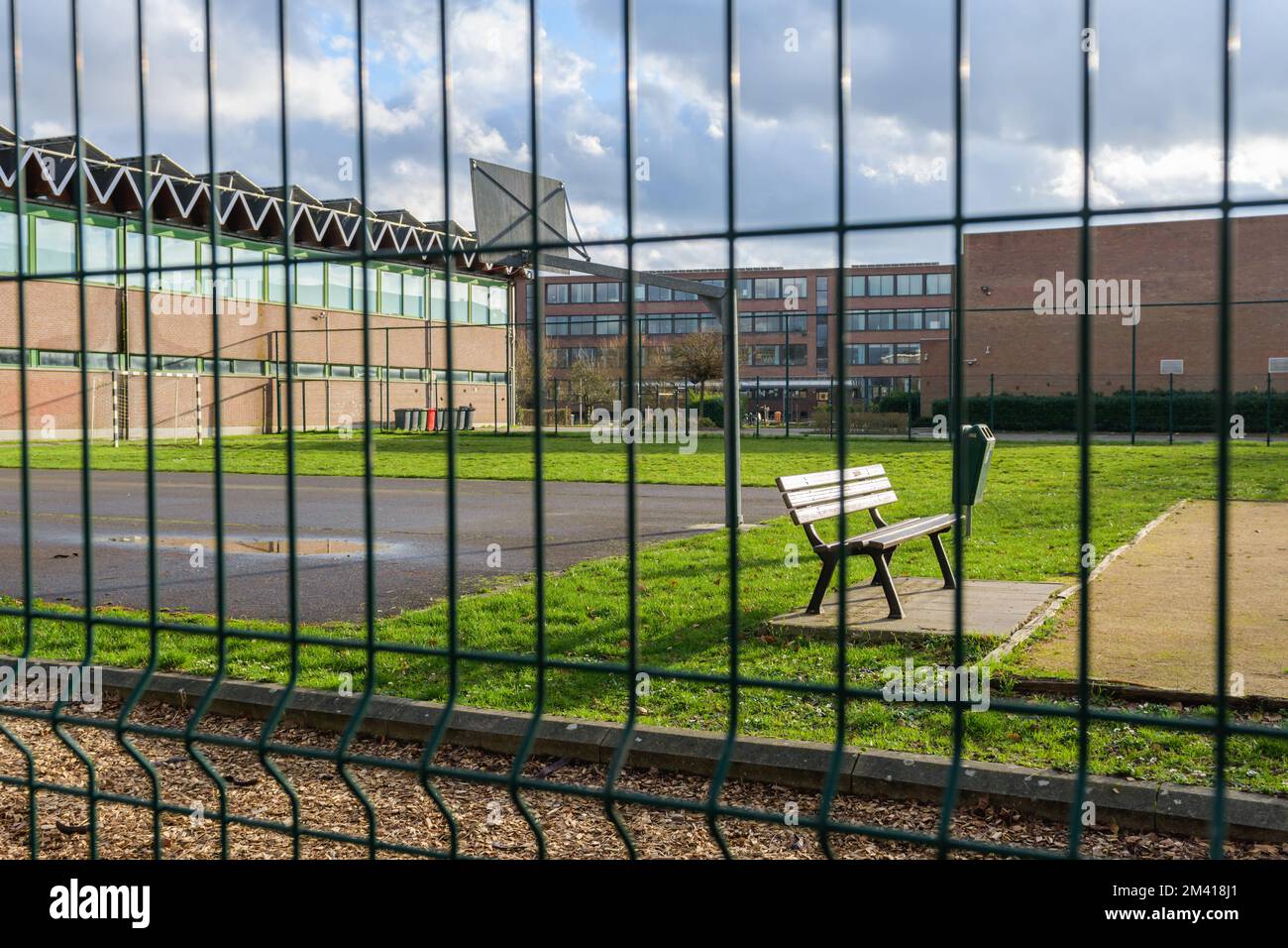 An empty fenced sports ground without people Stock Photo - Alamy