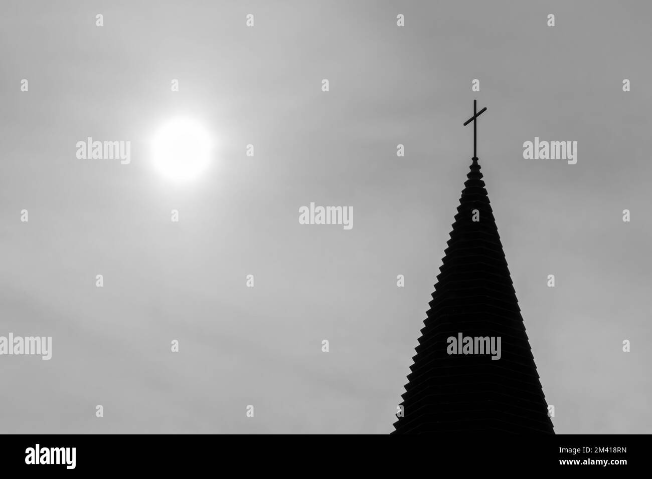 Fragment of the cone of the church against a gray sky with a glimpse of ...