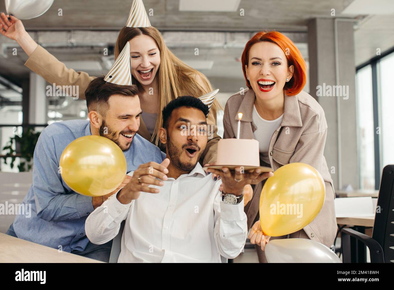 Business team celebrating a birthday of collegue in the modern office ...