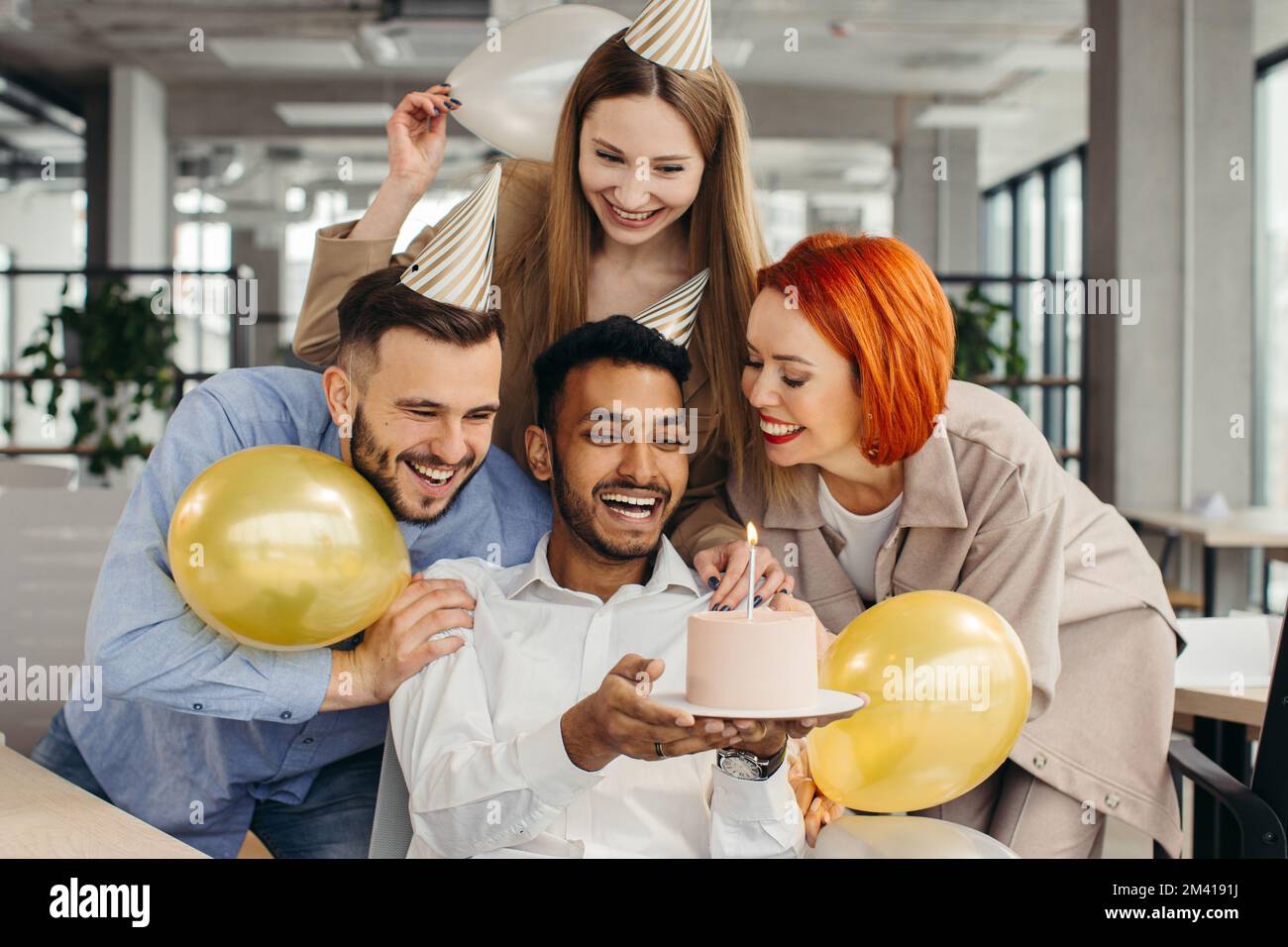 Business team celebrating a birthday of collegue in the modern office ...